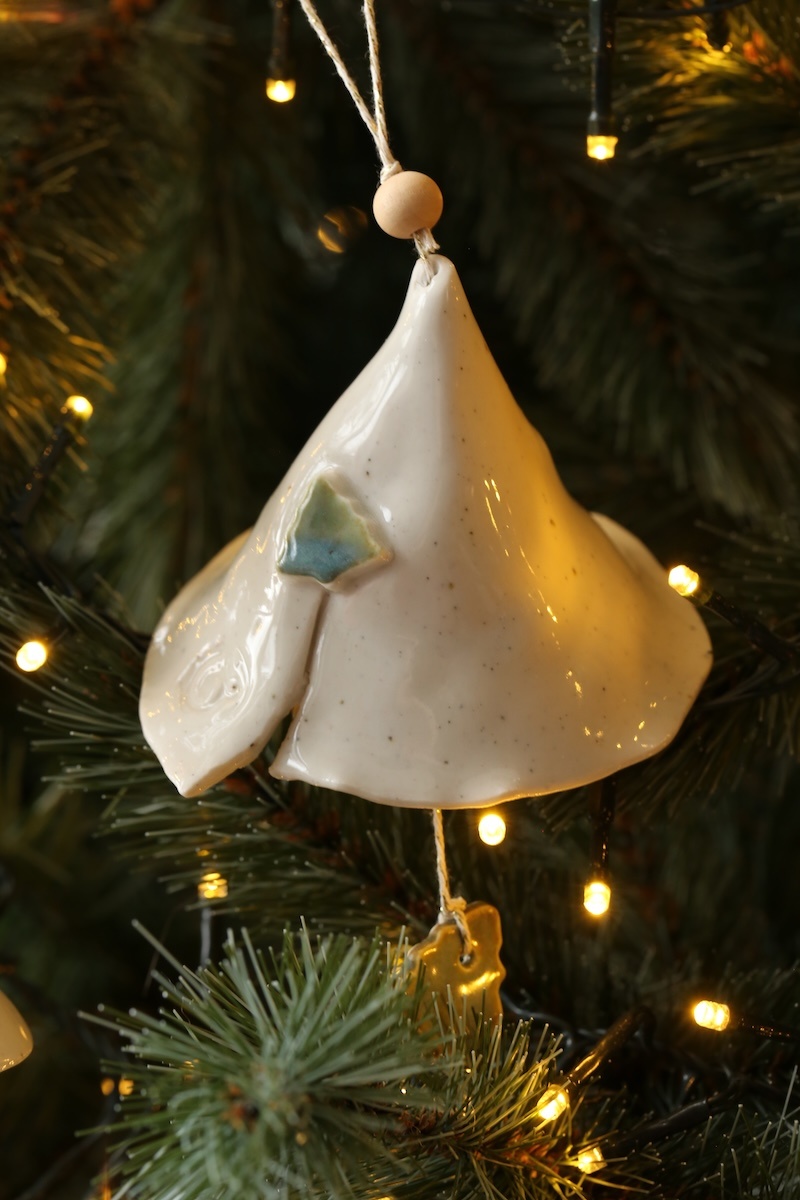 Handmade porcelain Christmas bell decorated with a Christmas tree ...