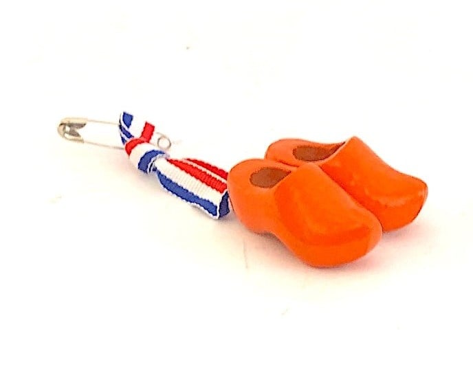 Corsage with orange clogs